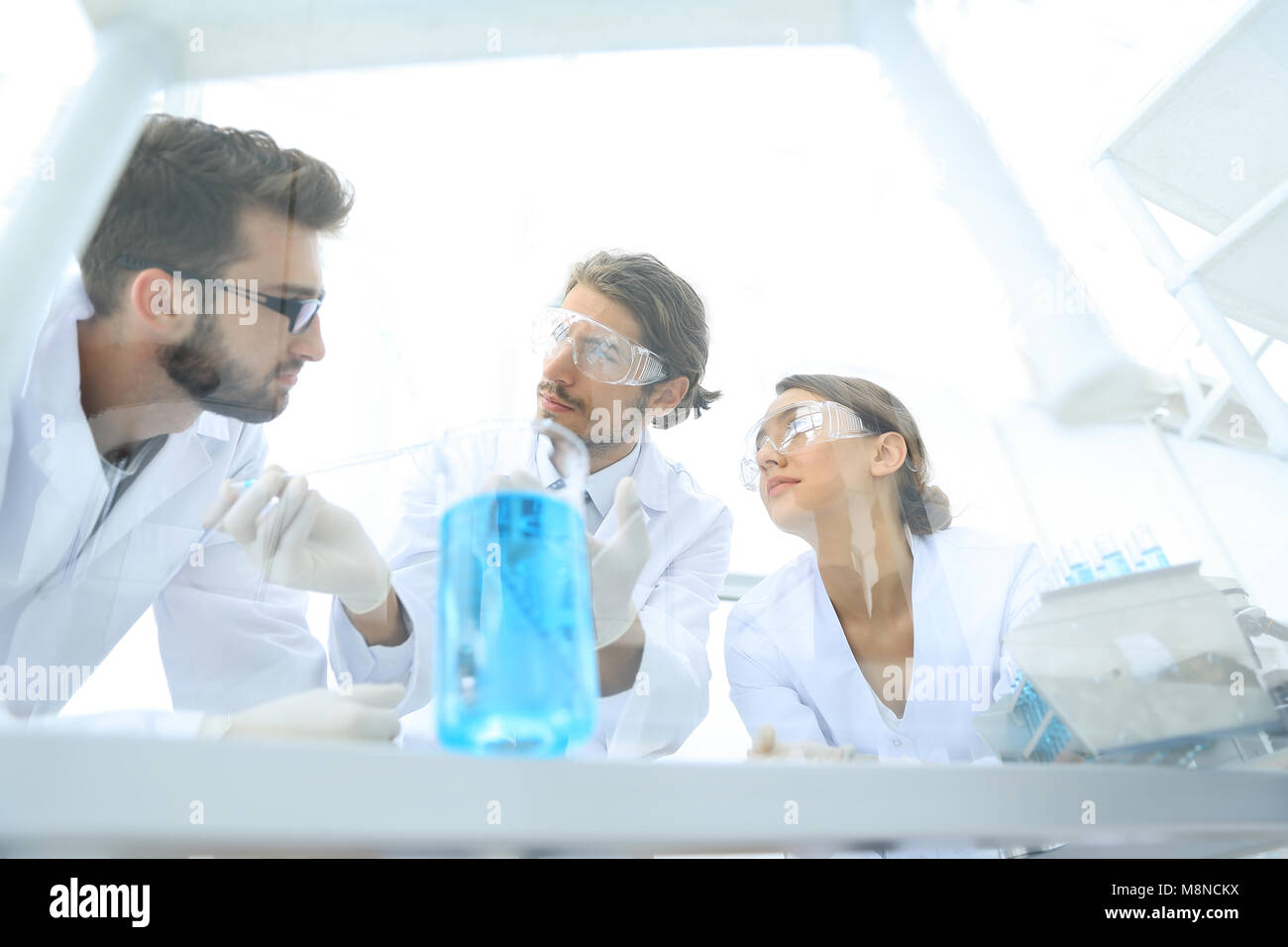 Group of scientists working on an experiment at the laboratory Stock ...
