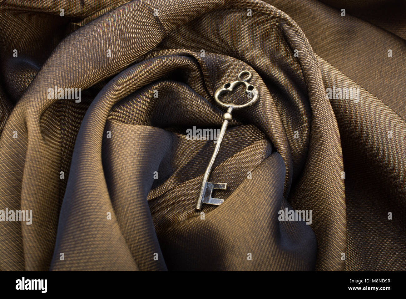 Retro styled color decorativel key place on fabric Stock Photo - Alamy
