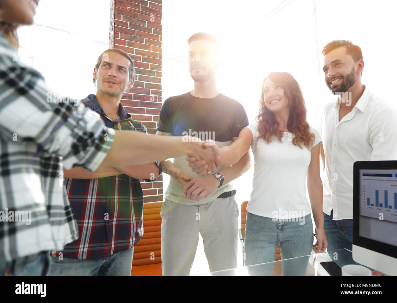 handshake young designer and the client Stock Photo - Alamy