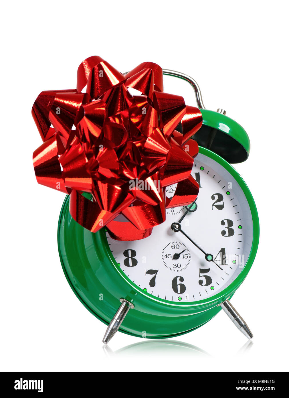 Alarm clock with red gift bow. Time for the holiday's concept with ...