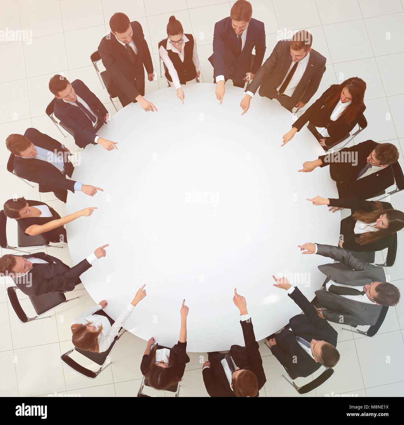 business team indicates the center of the round table Stock Photo - Alamy