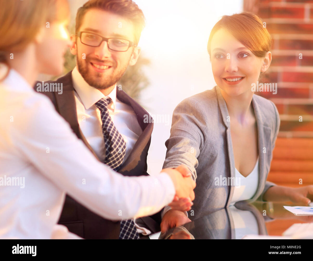business woman greets the employee with a handshake Stock Photo - Alamy