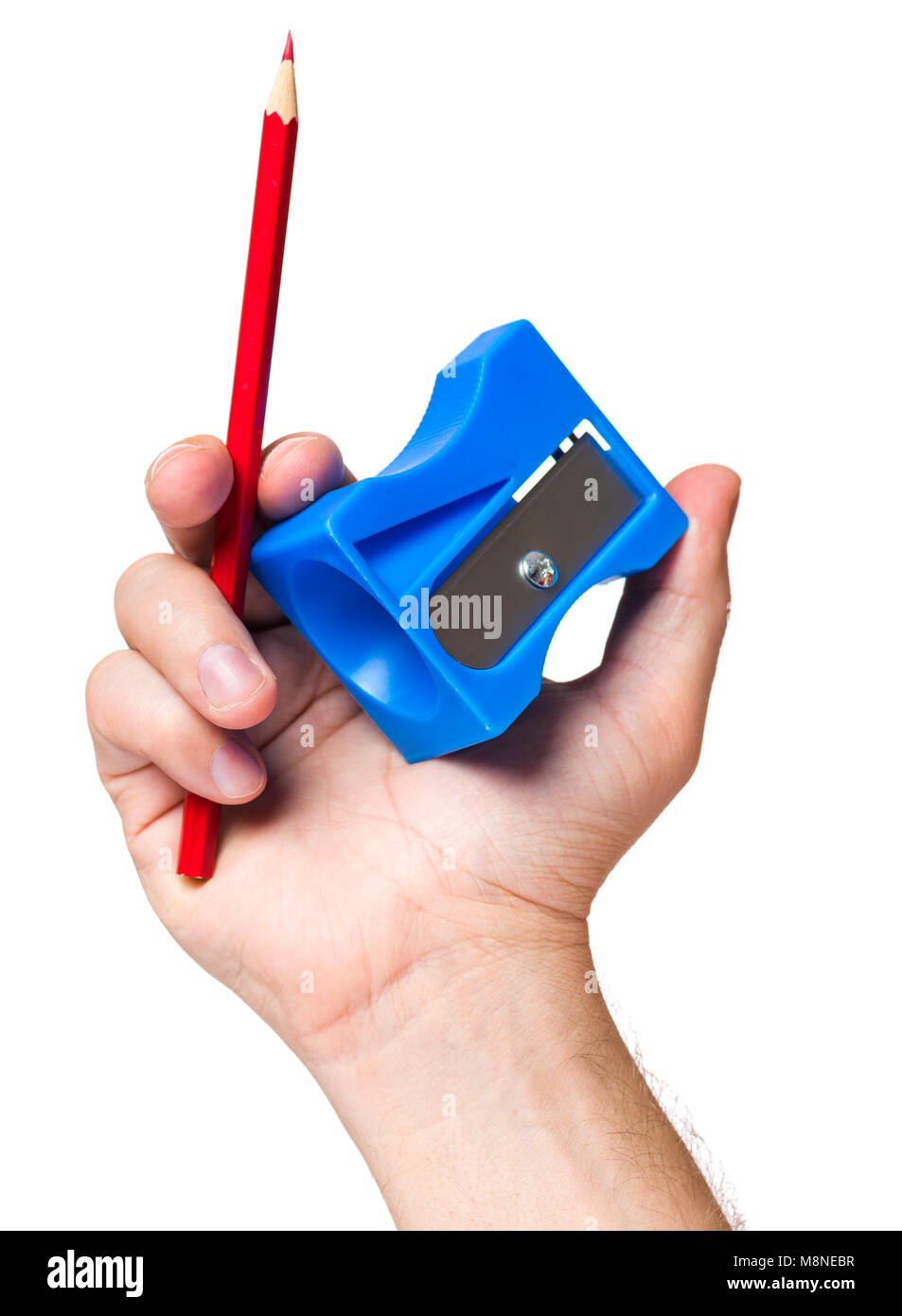 Male hand holding blue sharpener and red pencil, isolated on white ...