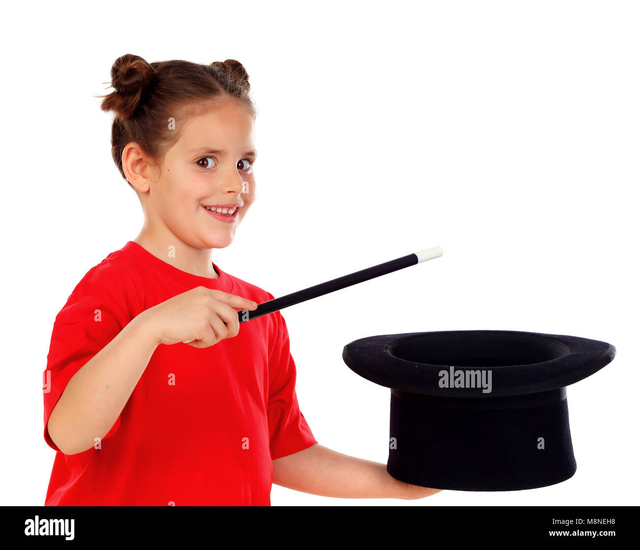 Pretty little girl doing magic with a top hat and a magic wand isolated ...