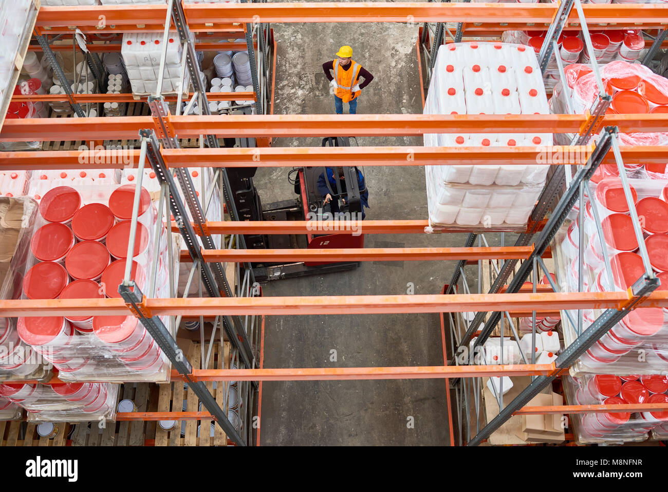 Above view background image of tall shelf rows in modern warehouse with ...