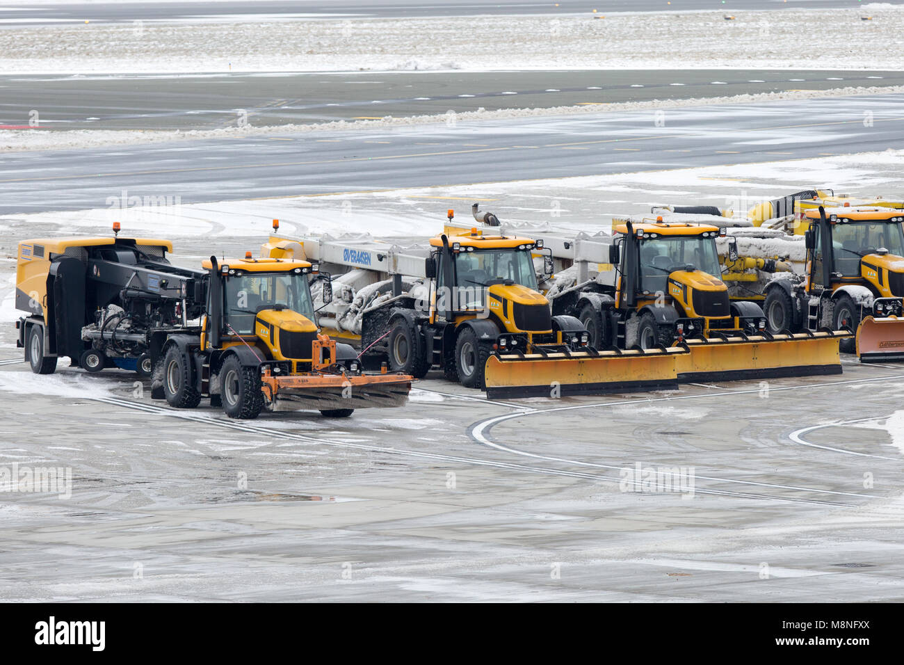 snow ploughs at Luton Airport Stock Photo - Alamy