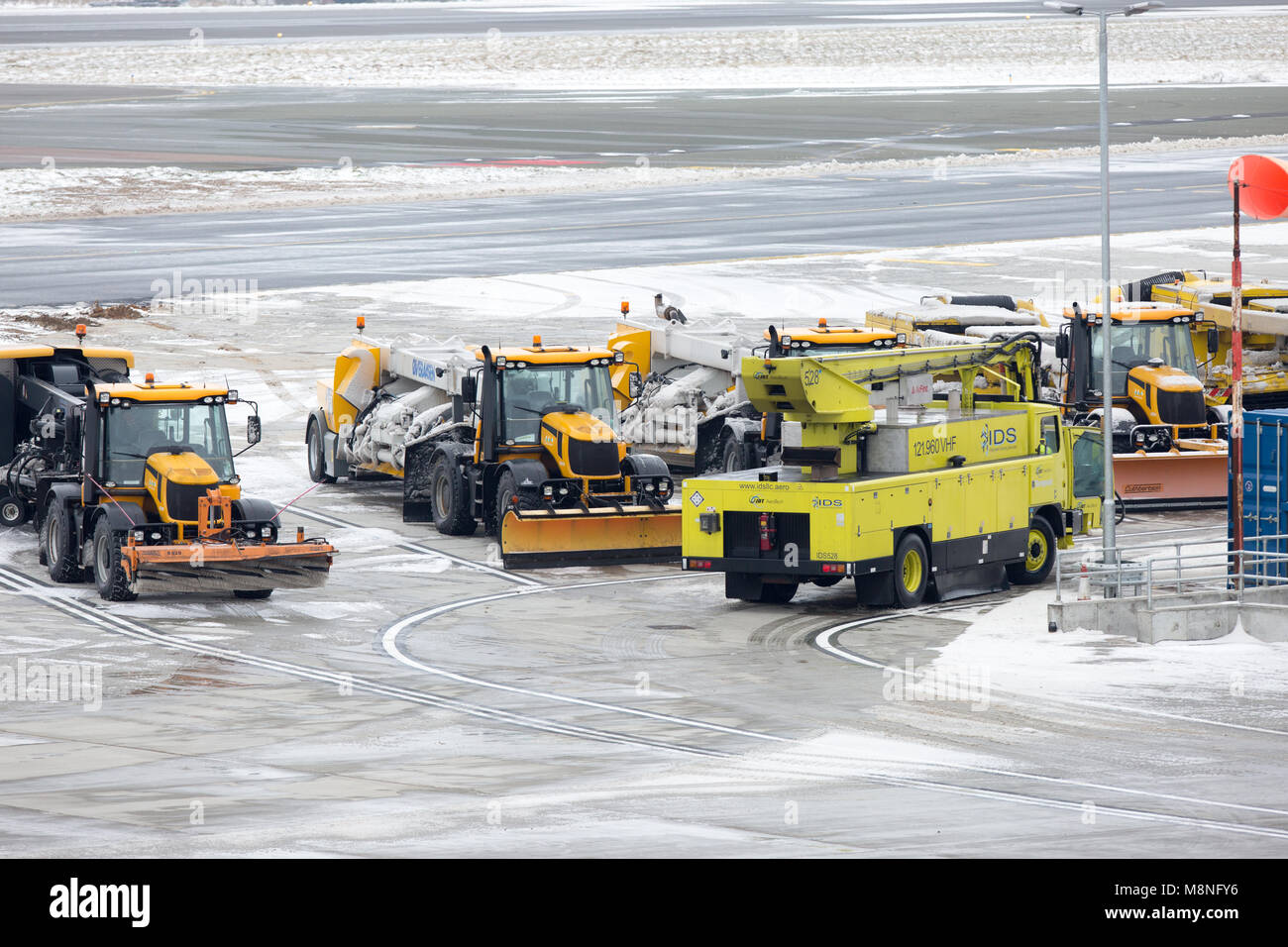 snow ploughs at Luton Airport Stock Photo - Alamy