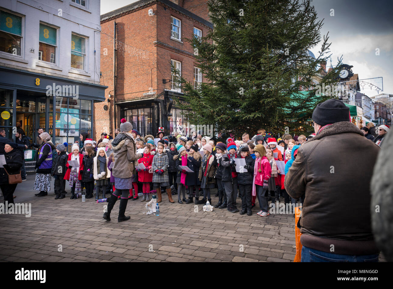 Young school children singing Christmas carol prior to Christmas, High ...