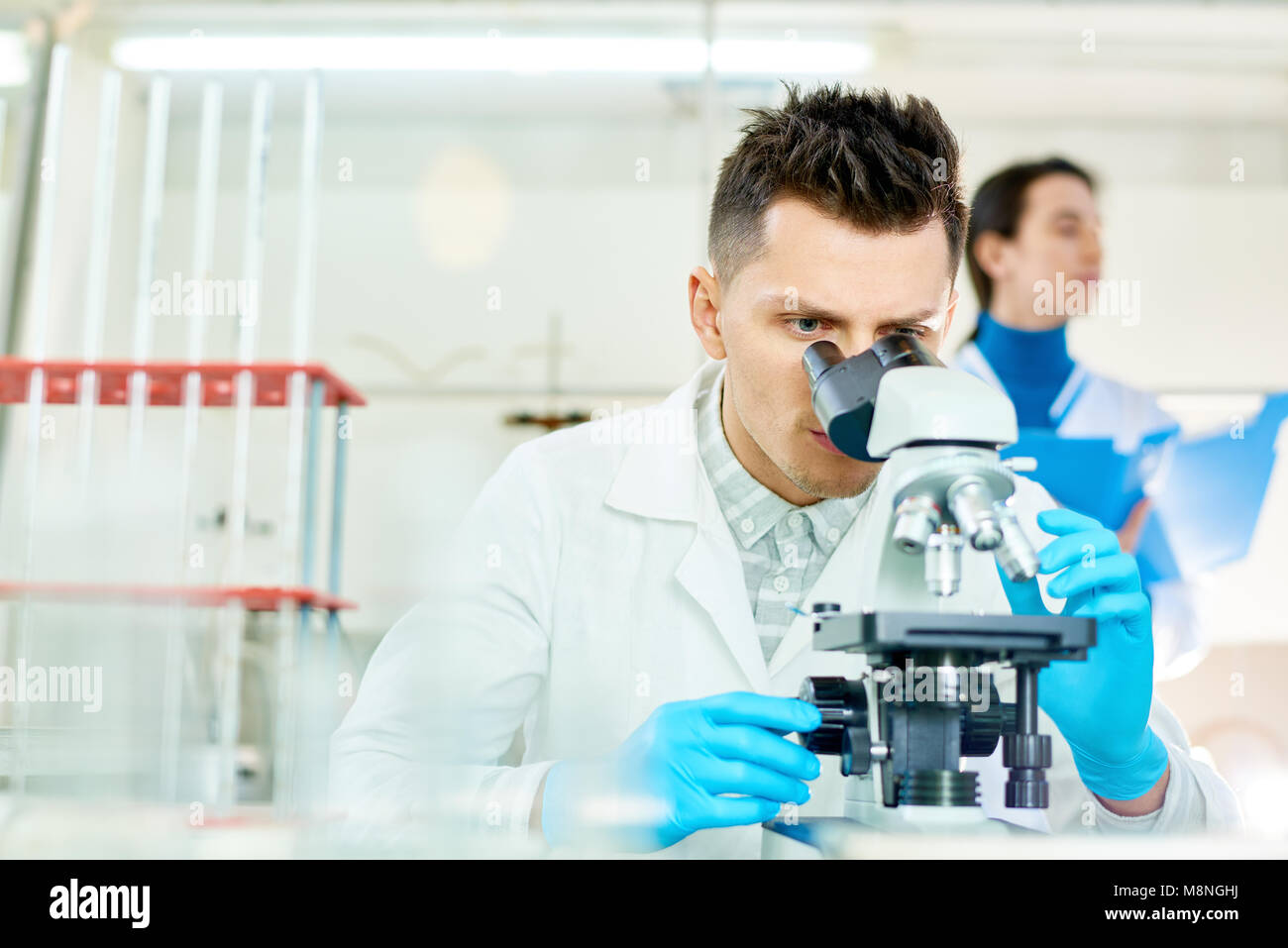 Young Scientist Using Microscope Stock Photo - Alamy