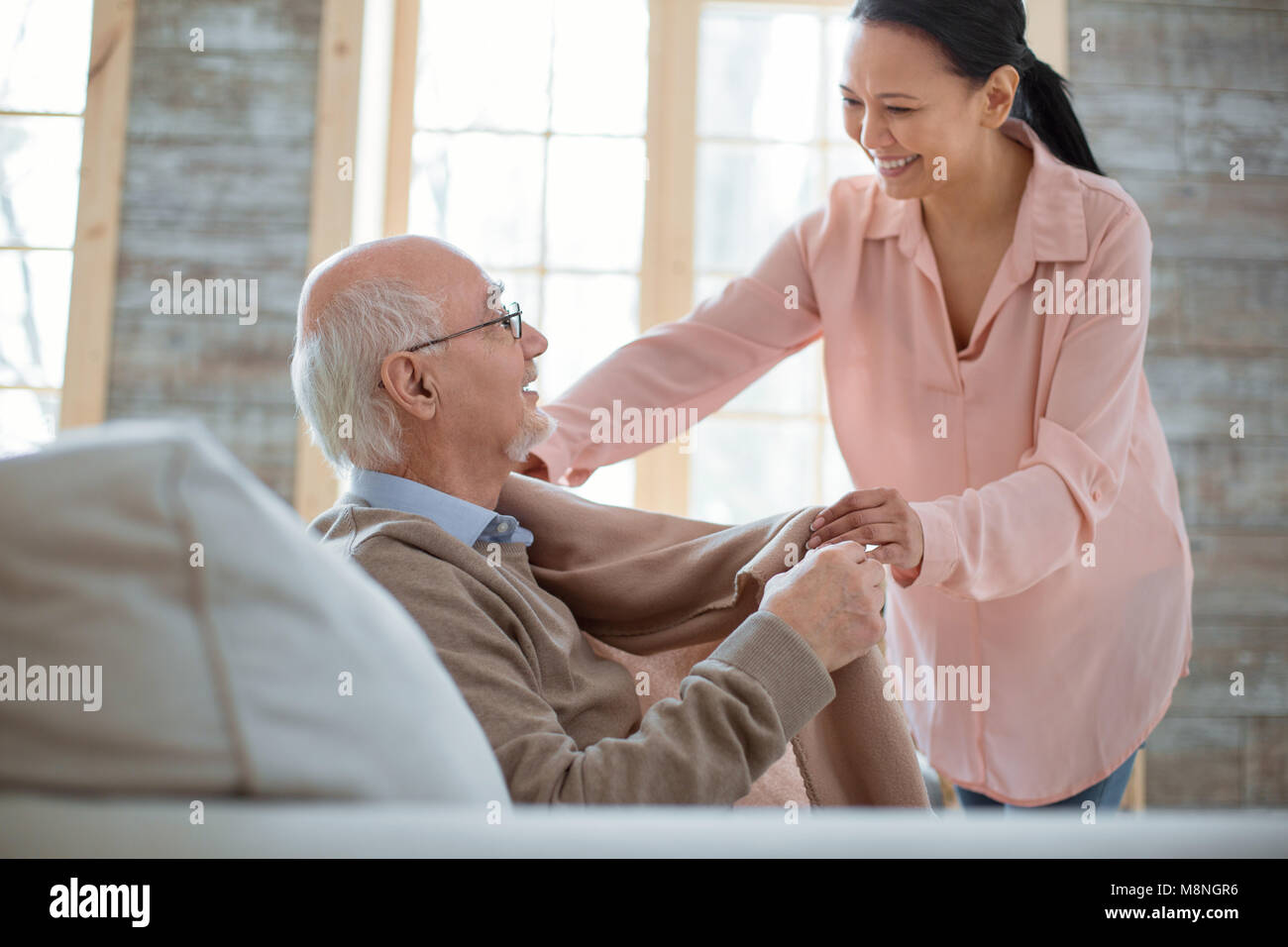 Glad senior man asking for help caregiver Stock Photo - Alamy