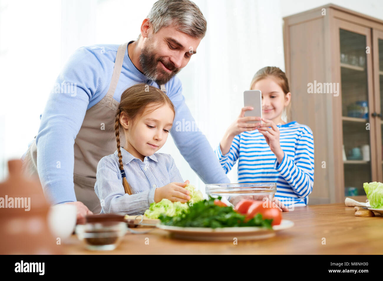 Adorable Family Scene Stock Photo - Alamy
