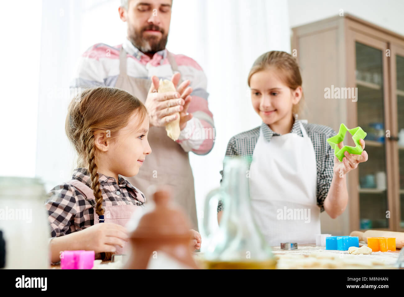 Family Making Cookies Stock Photo - Alamy
