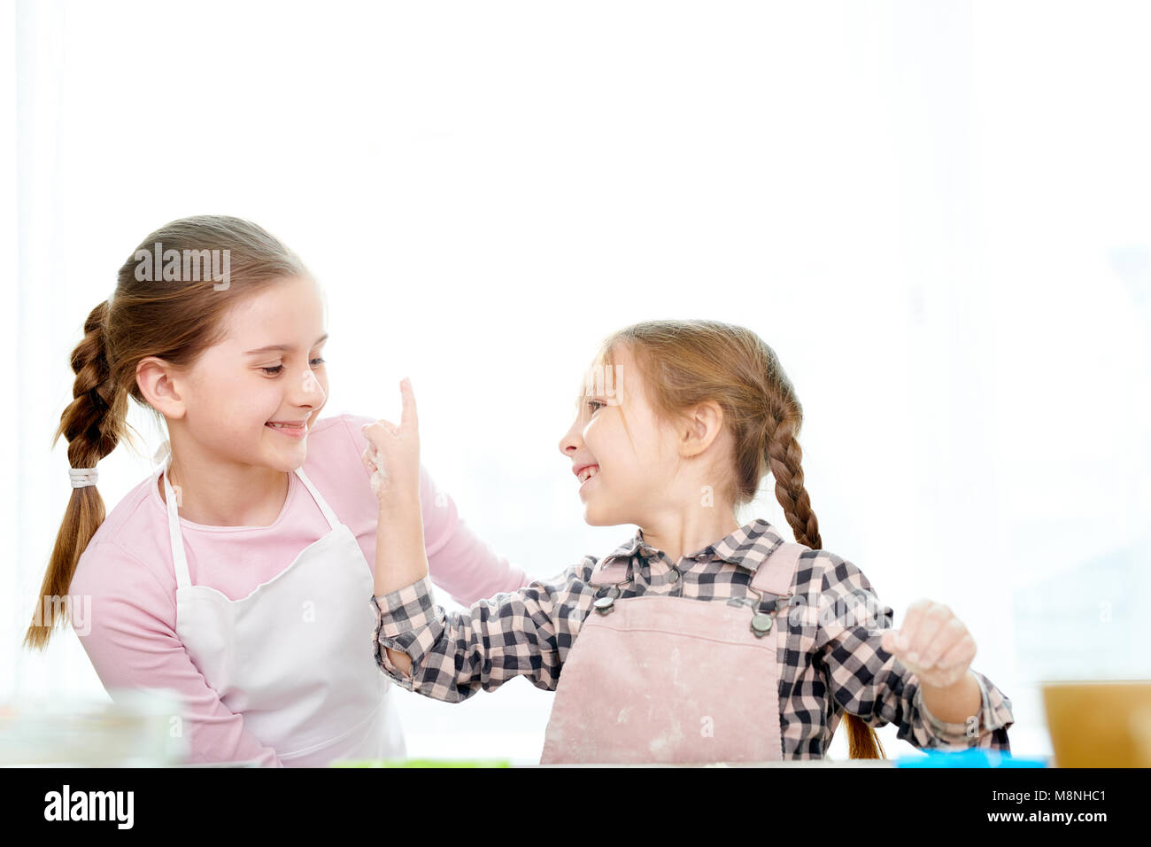 Adorable Sisters Cooking Together Stock Photo - Alamy