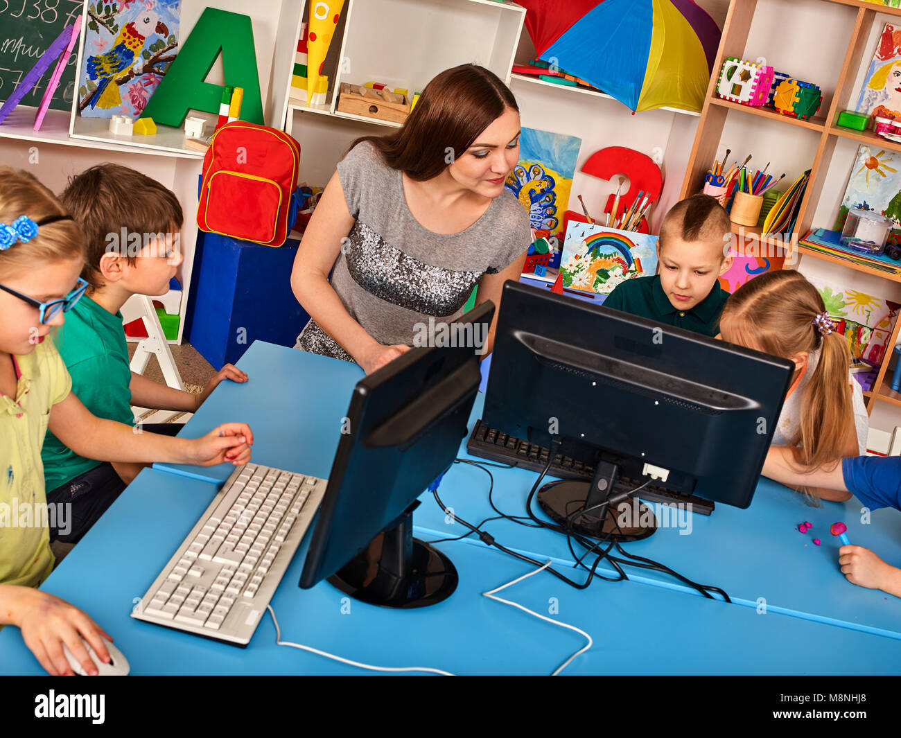 Children computer class us for education and video game Stock Photo - Alamy