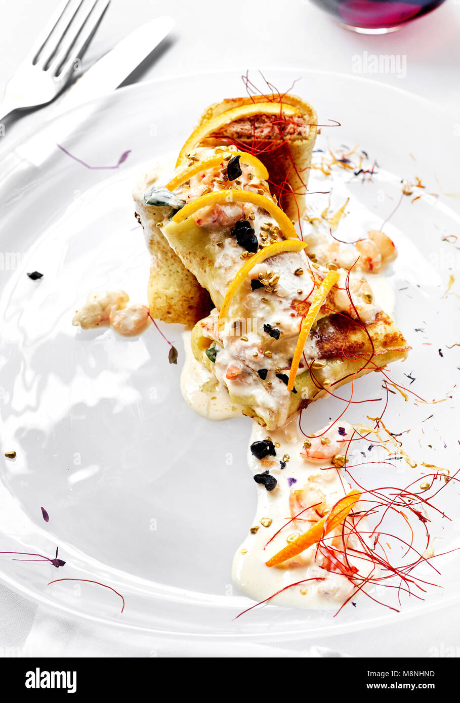 Crepes with prawns and cream cheese sauce Stock Photo - Alamy