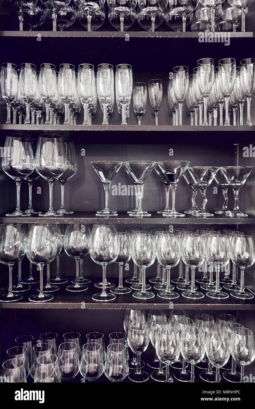 Variety of empty crystal glasses on a shelves Stock Photo - Alamy