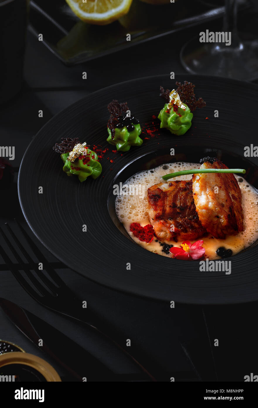 Sturgeon fillets in a creamy sauce Stock Photo - Alamy