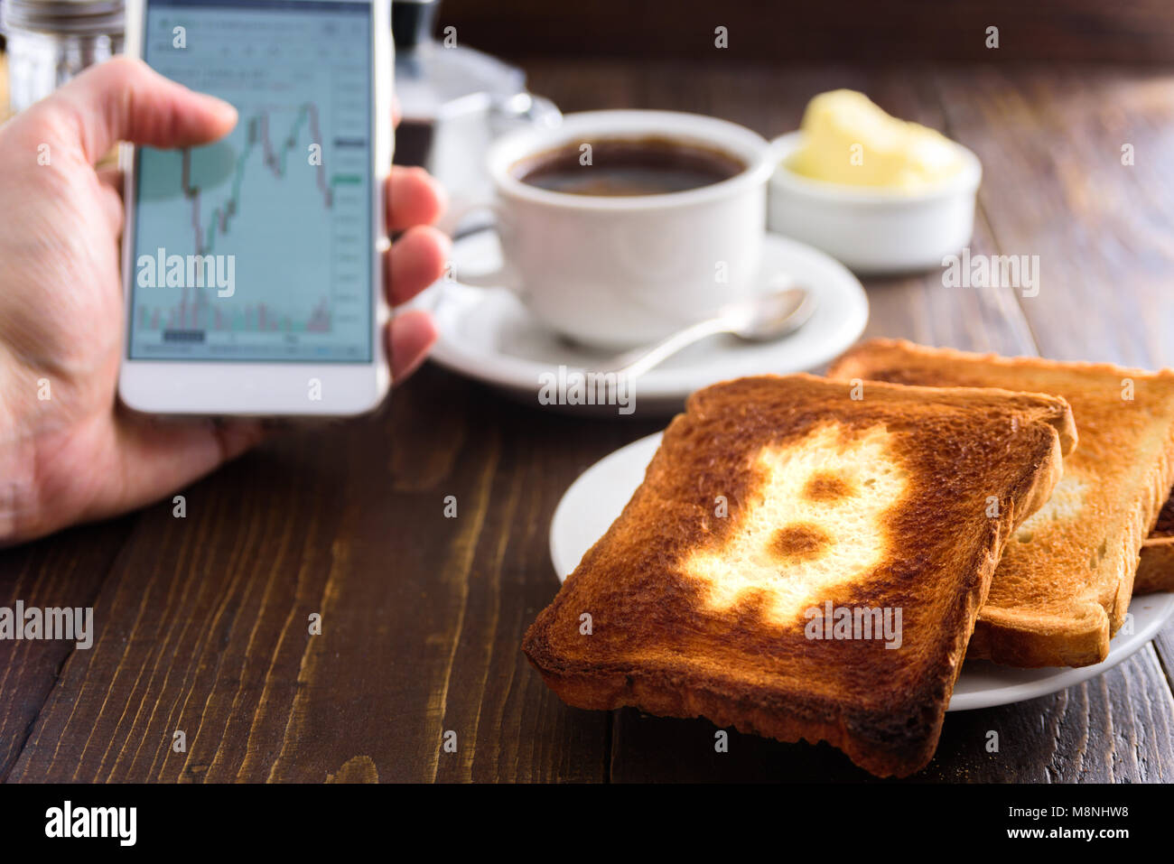 Breakfast of businessman with coffee and phone. Toast with bitcoin ...