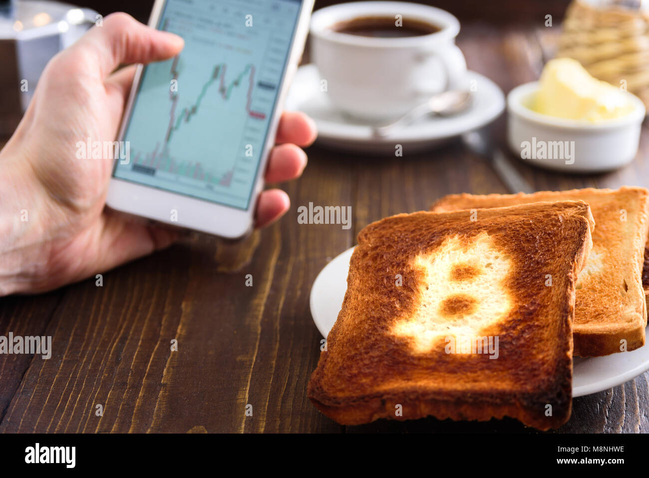 Breakfast of businessman with coffee and phone. Toast with bitcoin ...