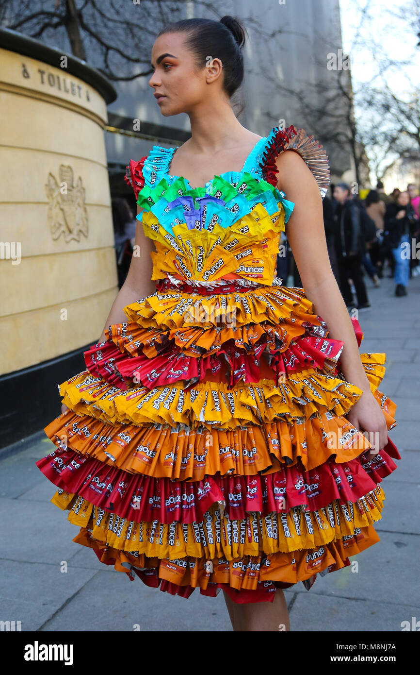 A model showcasing an outfit made out of bounce chocolate bar wrappings ...