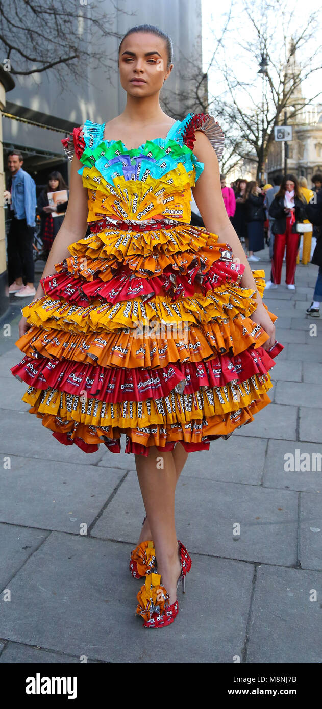 A model showcasing an outfit made out of bounce chocolate bar wrappings ...