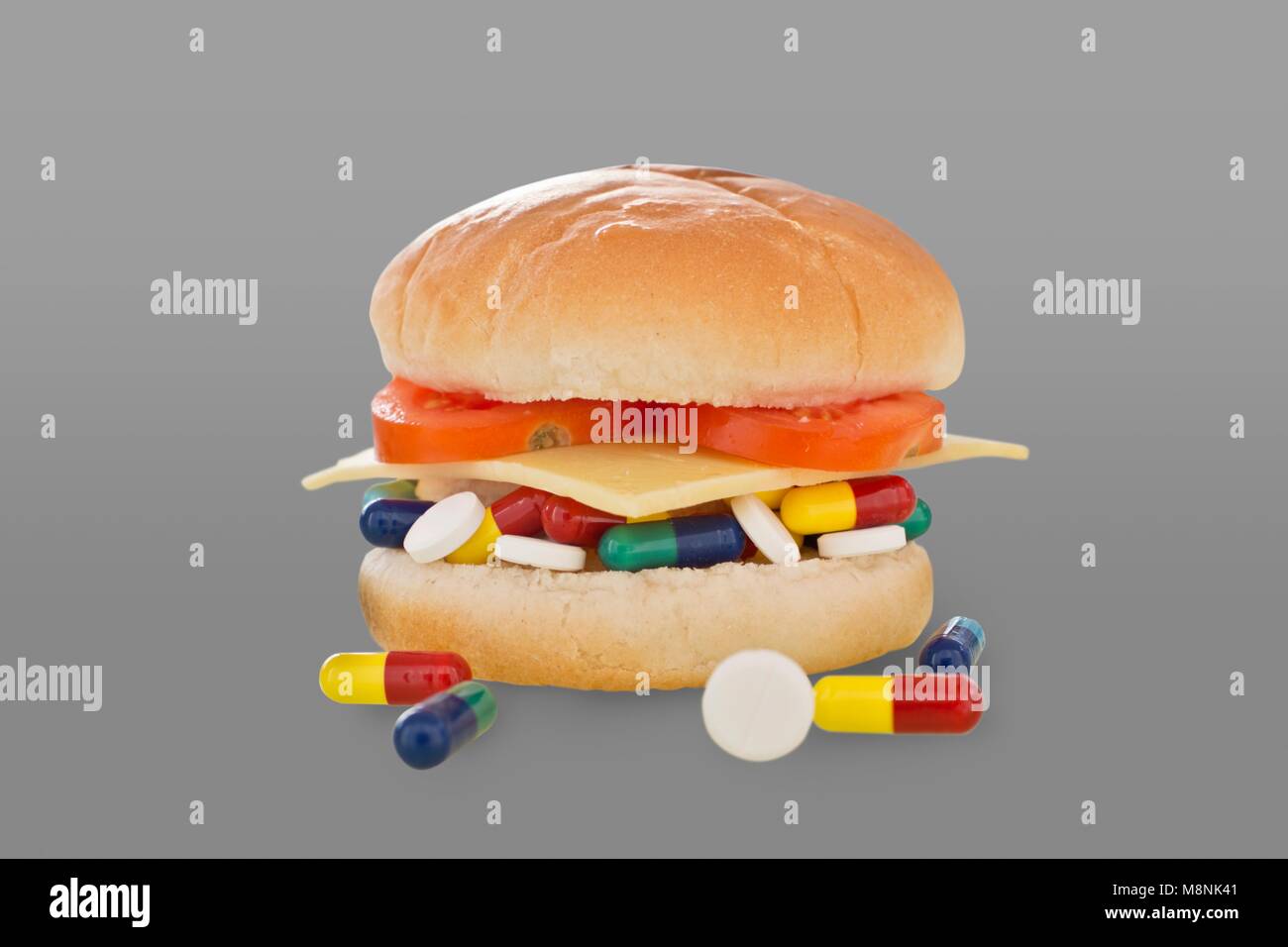 Pills in a burger, conceptual image of antibiotics in food Stock Photo ...