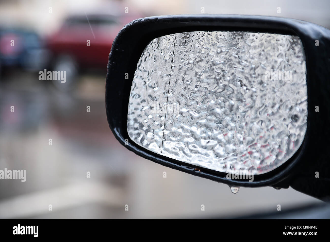 Car mirror covered in ice during freezing rain phenomenon Stock Photo ...