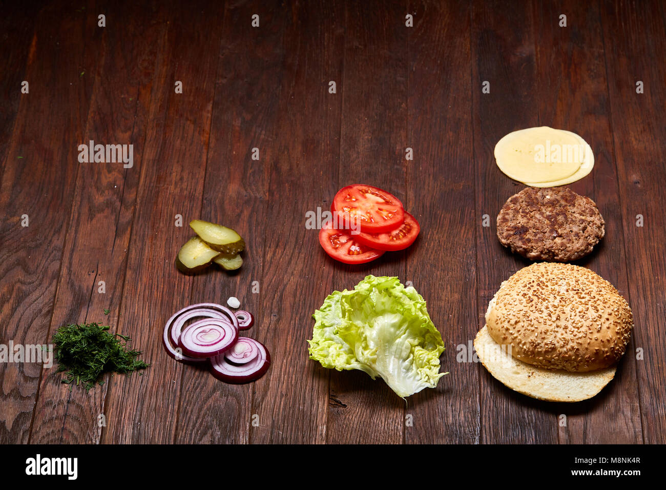 Tasty hamburger ingredients are laid out separately from above ...