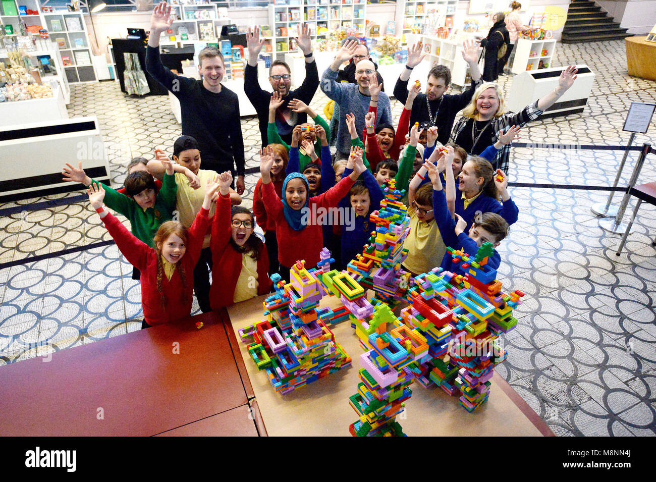 Staff and pupils from the Globe Primary School with a Lego sculpture ...