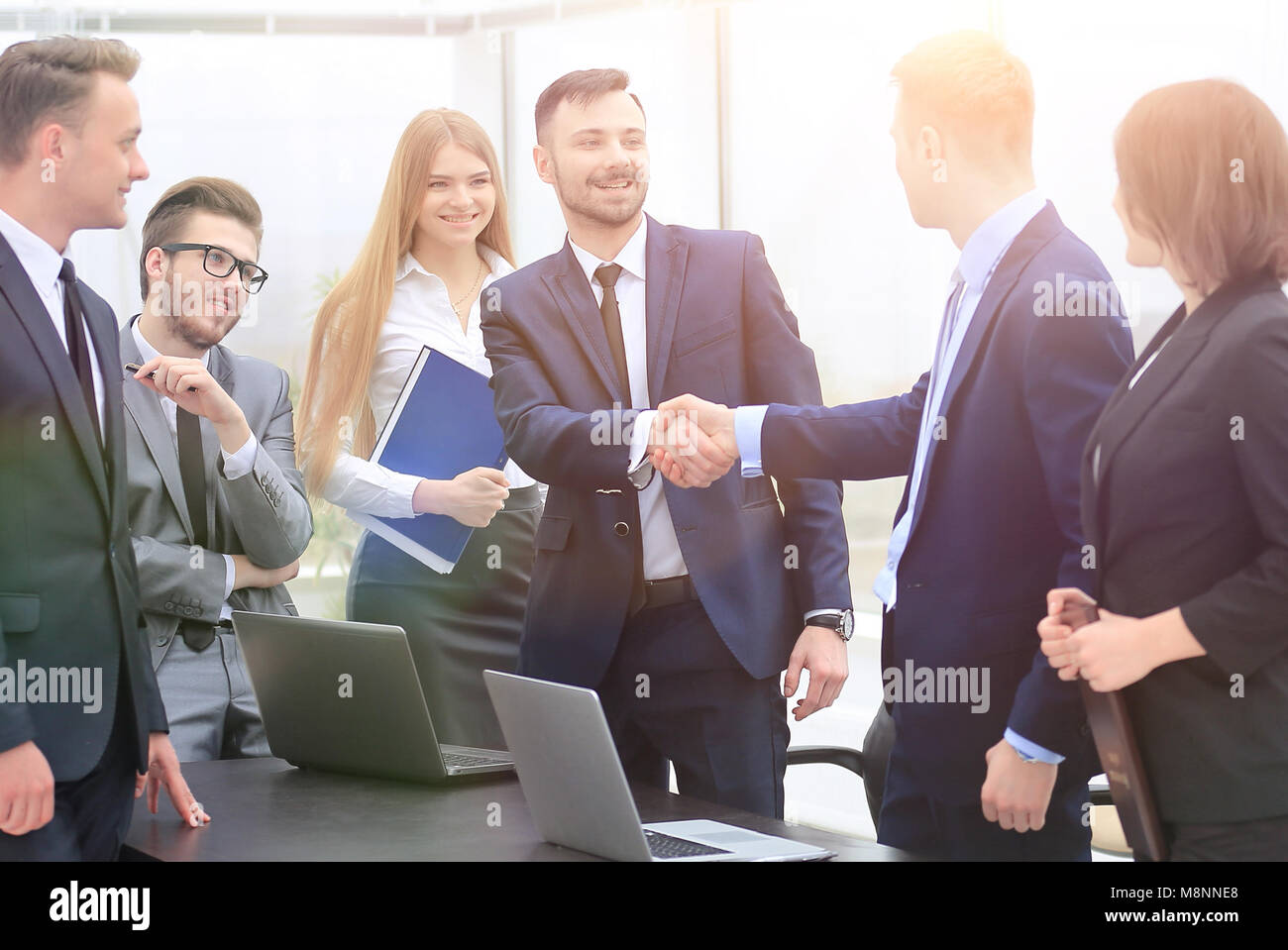 handshake between representatives of the two business teams Stock Photo ...