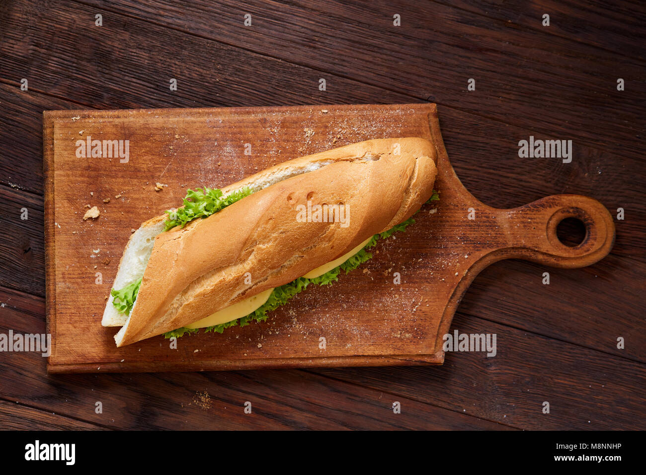 Fresh and tasty submarine sandwich with cheese and vegetables on ...