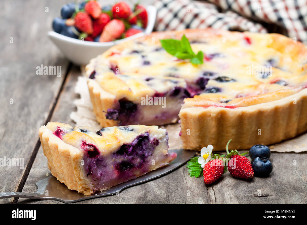 Cheesecake with wild forest berries. Summer dessert Stock Photo - Alamy