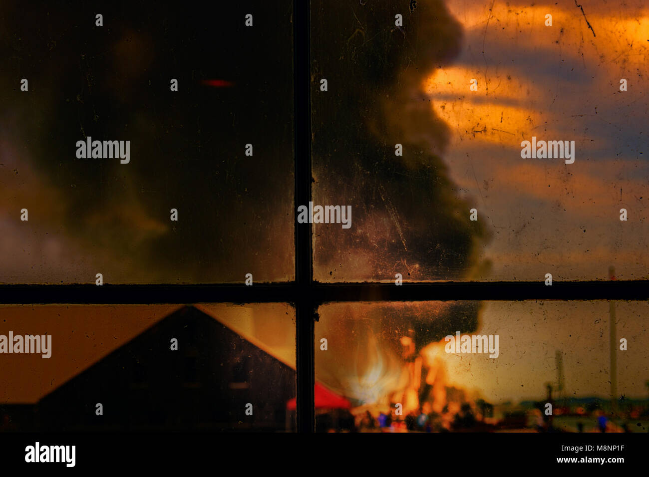 view from a window on a burning house, smoke and flames of fire, people ...