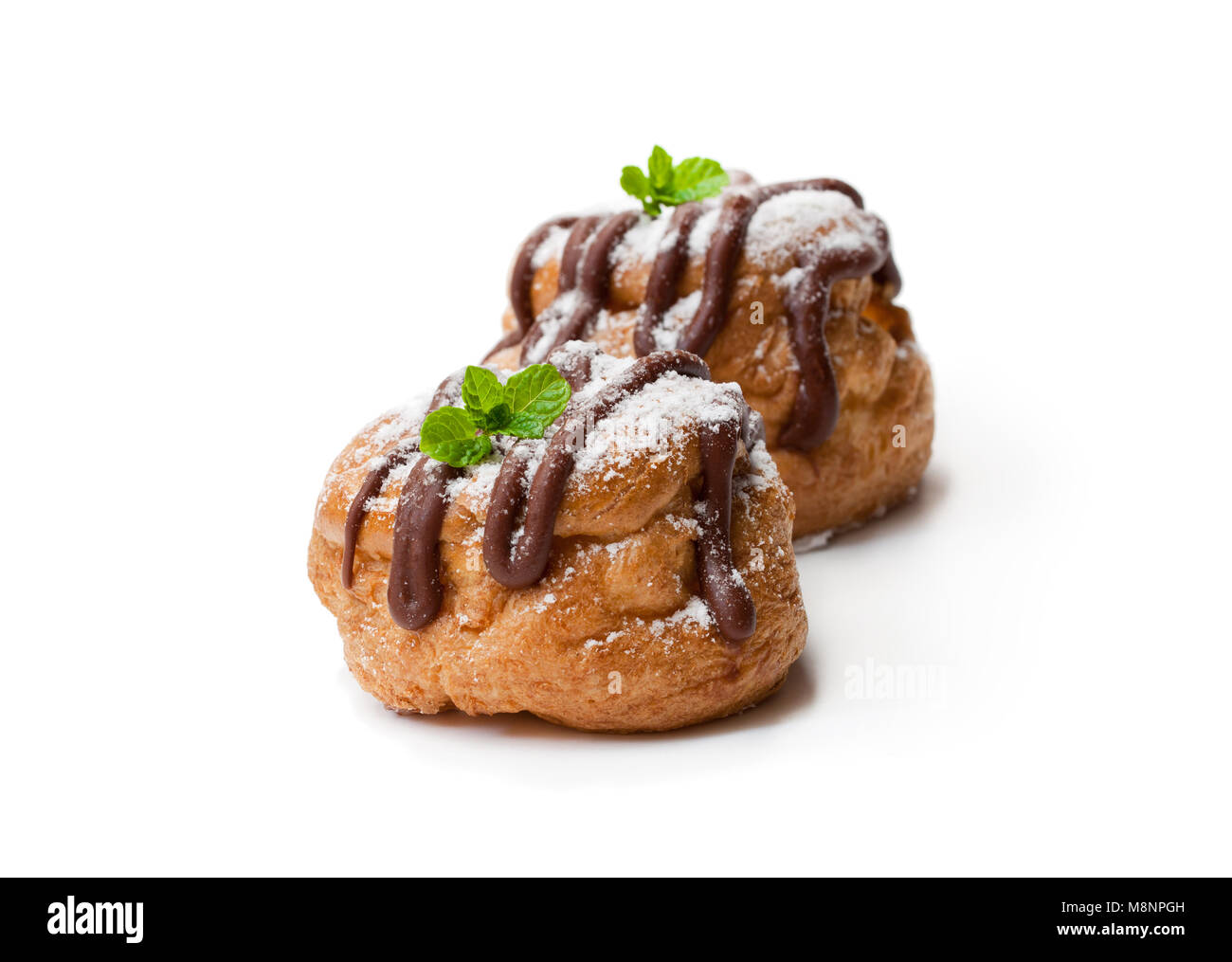 Belgian chocolate choux buns isolated on white Stock Photo - Alamy