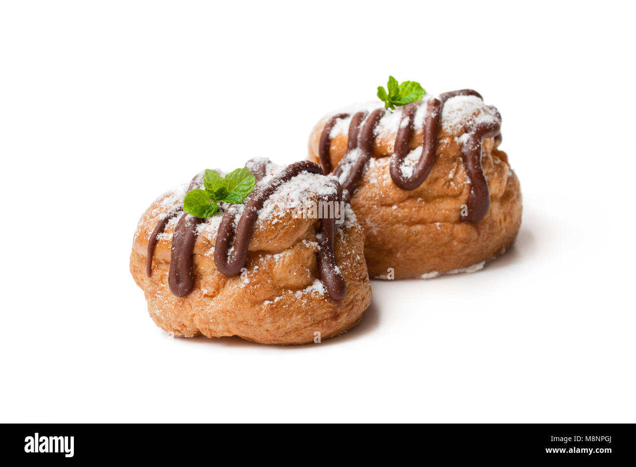 Belgian chocolate choux buns isolated on white Stock Photo - Alamy
