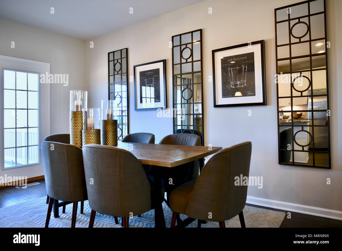 Dining room view with wood table inside modern home Stock Photo - Alamy