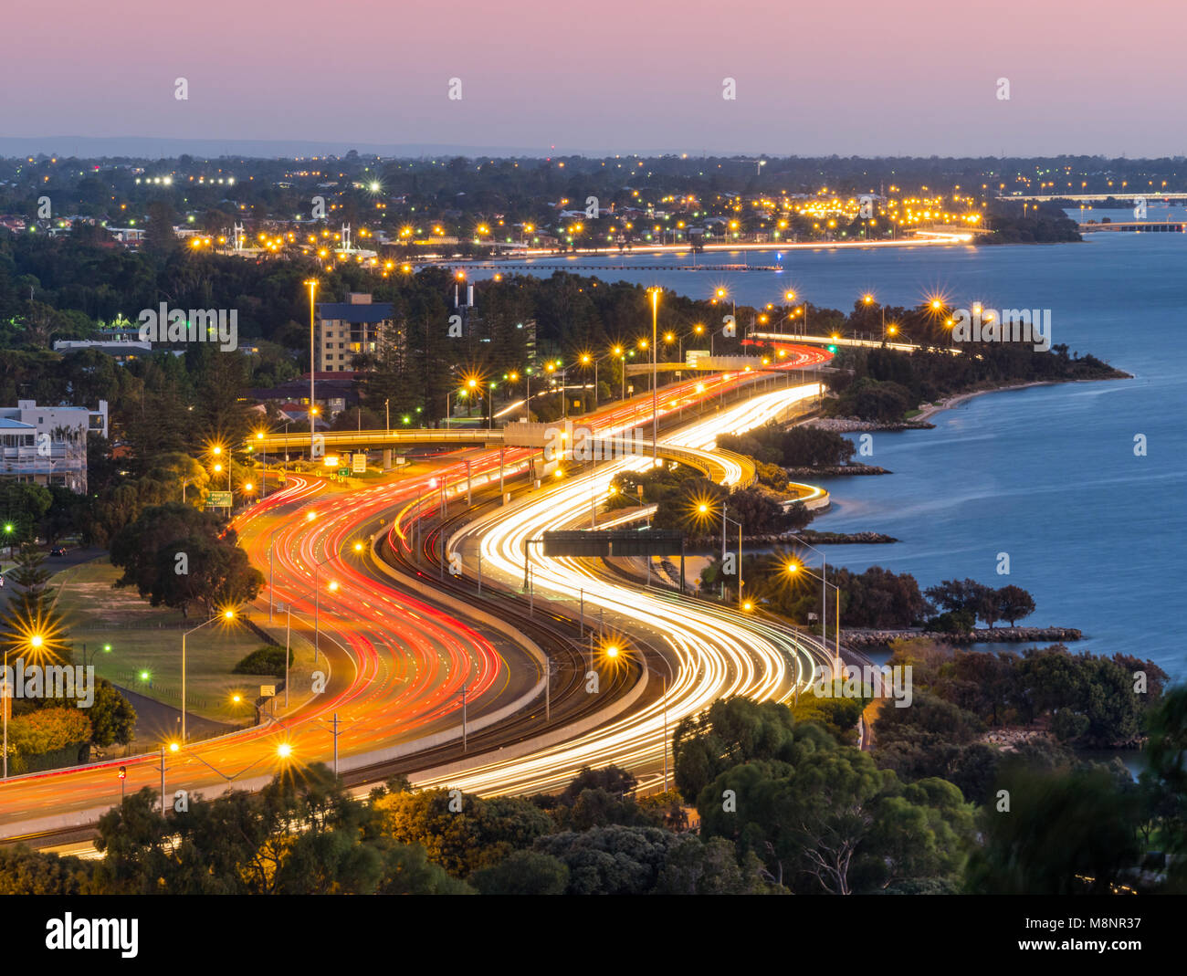 Evening Traffic along the Kwinana Freeway next to the Swan River in ...