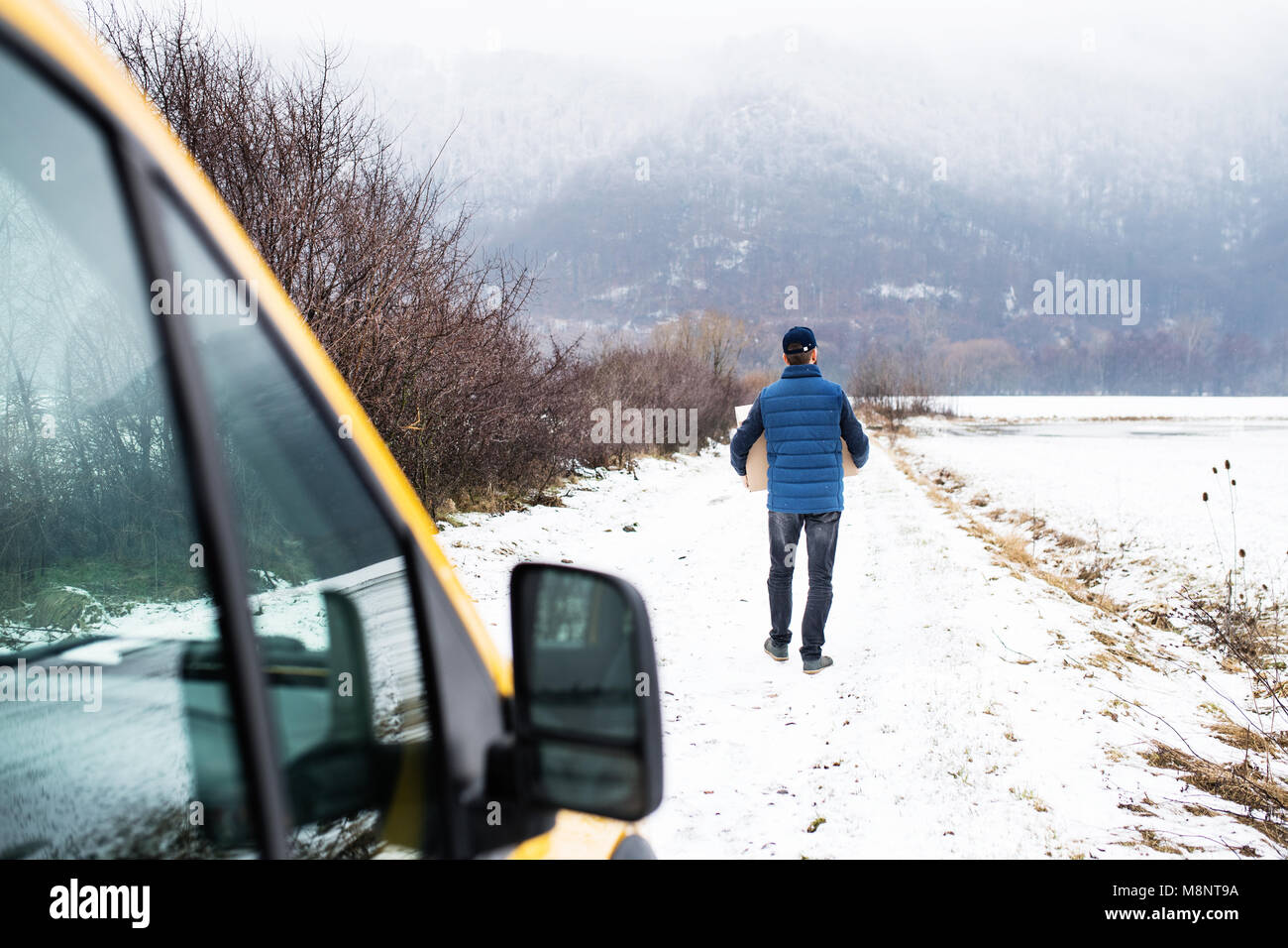 Male courier delivery service walking hi-res stock photography and ...