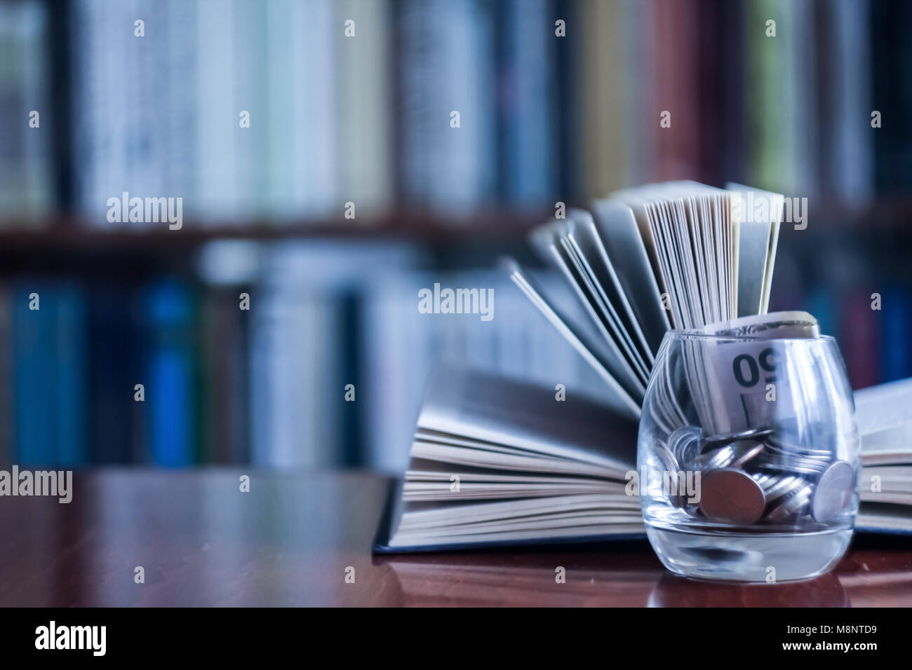 The books in the library on the table Stock Photo - Alamy