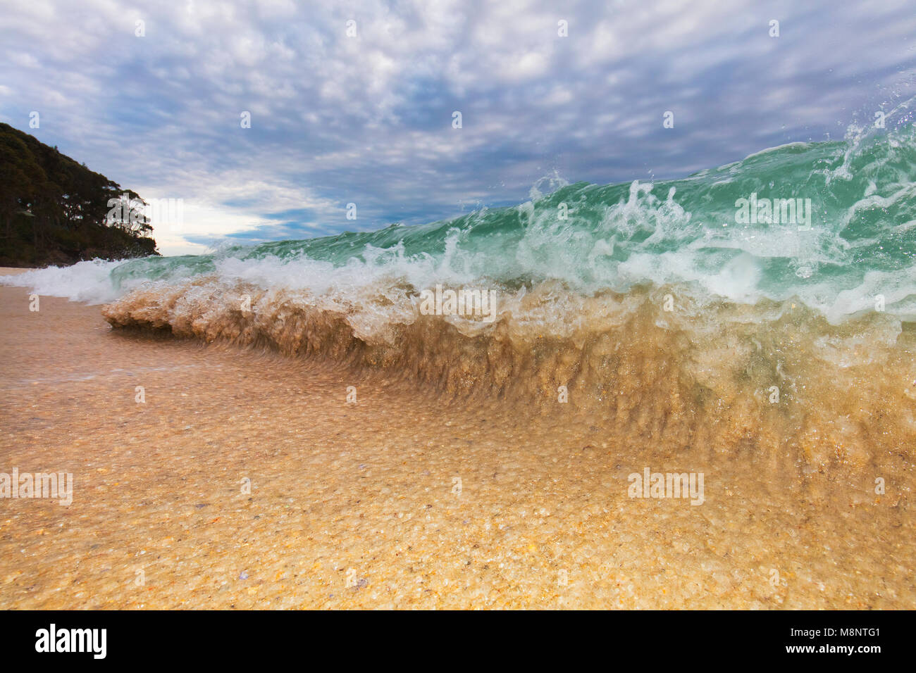 Colourful shore break with lots of energy Stock Photo - Alamy