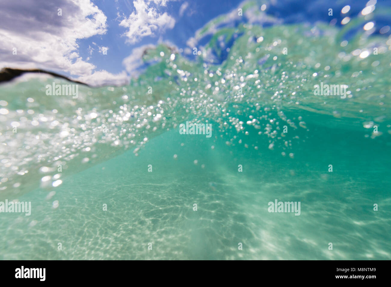 Clear turquoise Ocean water with blue sky Stock Photo - Alamy