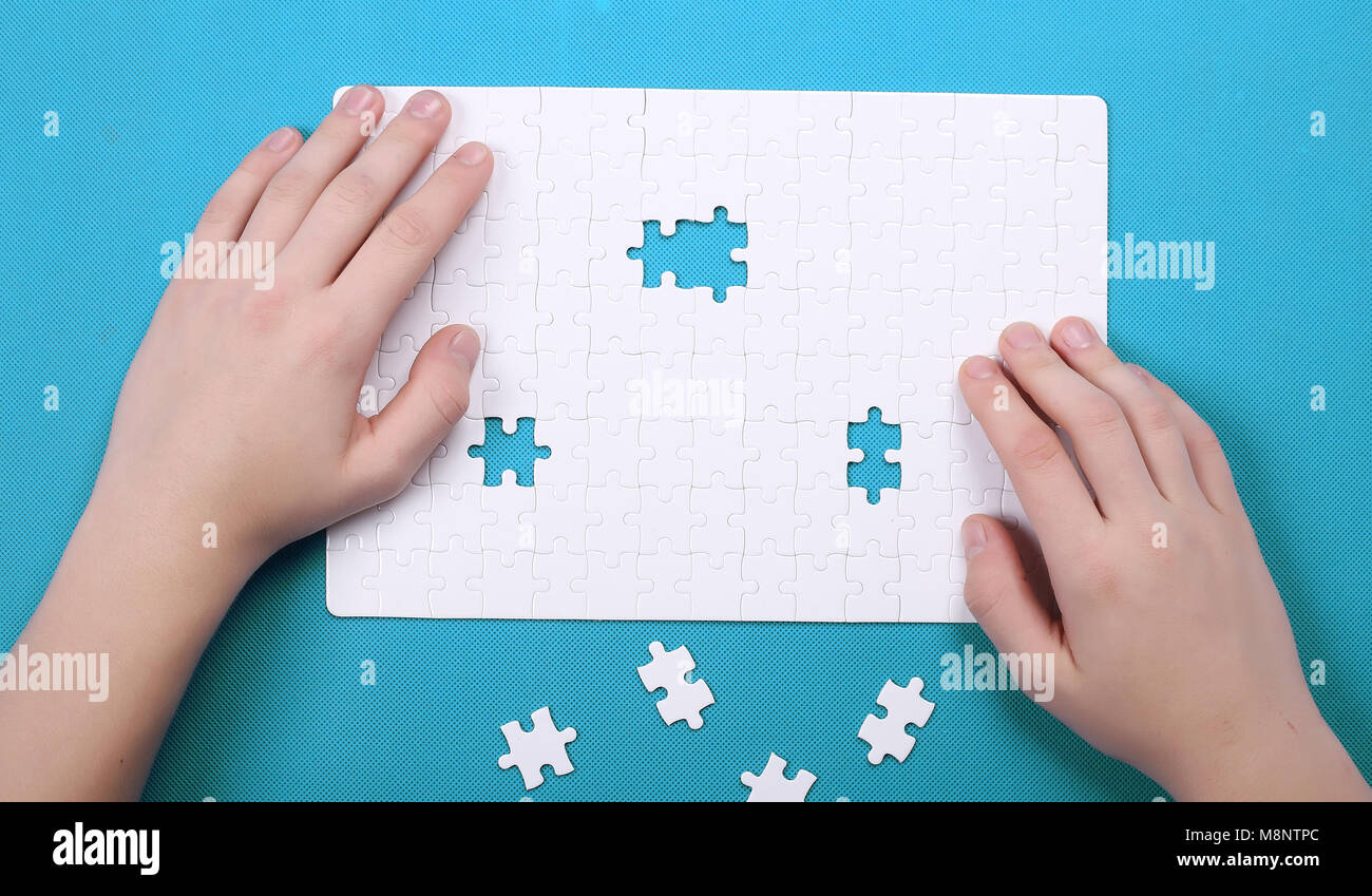 White details of puzzle on background. A puzzle is a puzzle from small ...