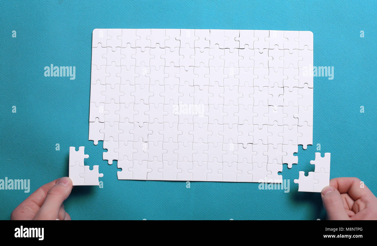 White details of puzzle on background. A puzzle is a puzzle from small ...
