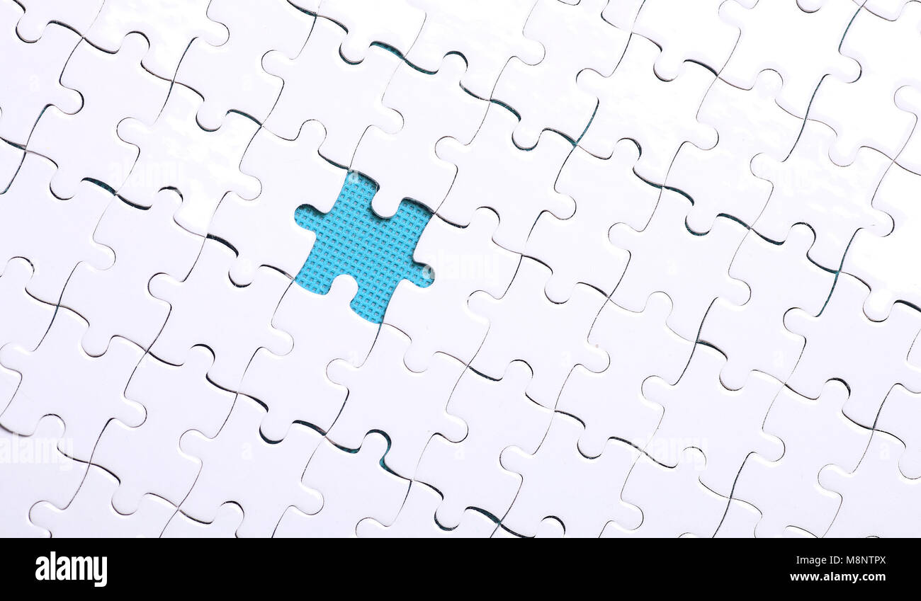 White details of puzzle on background. A puzzle is a puzzle from small ...