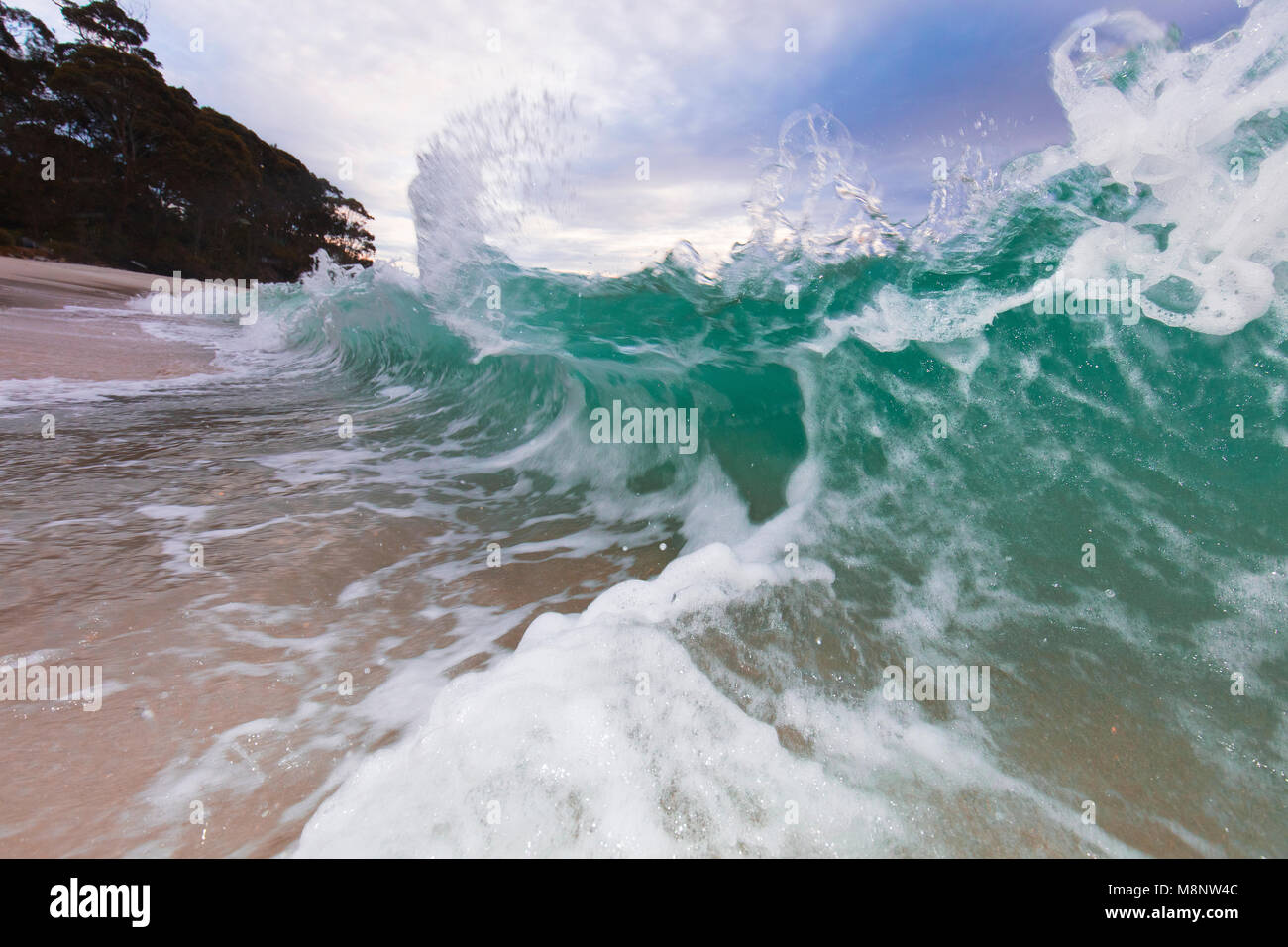 Colourful shore break with lots of energy Stock Photo - Alamy