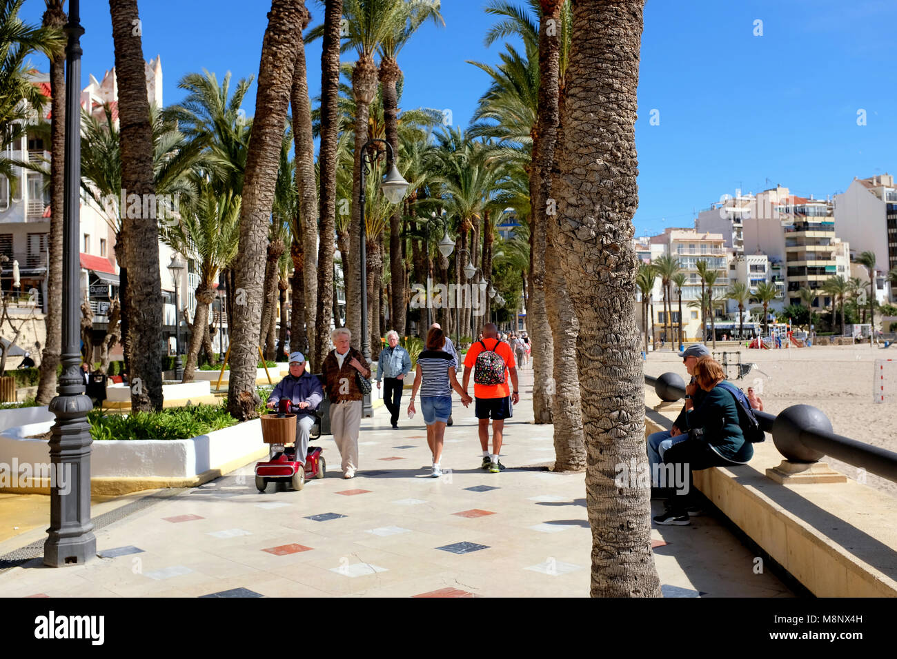 Benidorm, Spain. March 07, 2018. Holidaymakers walkng the promenade at ...