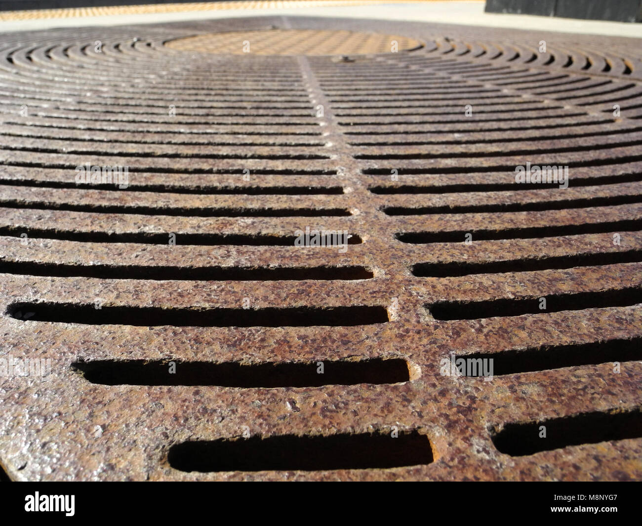 Manhole Cover Contrast and Pattern Stock Photo - Alamy