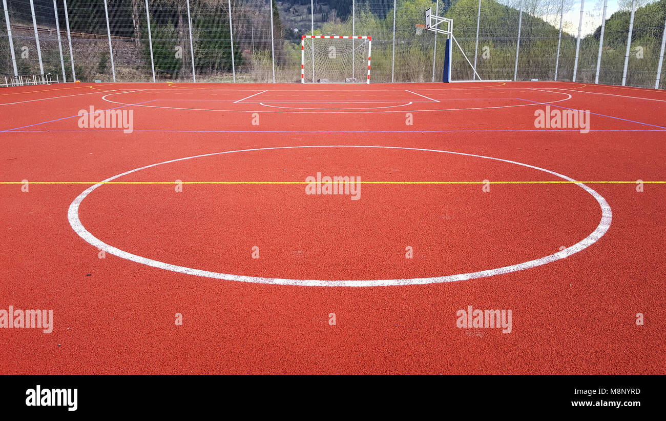 Red soccer field Stock Photo - Alamy