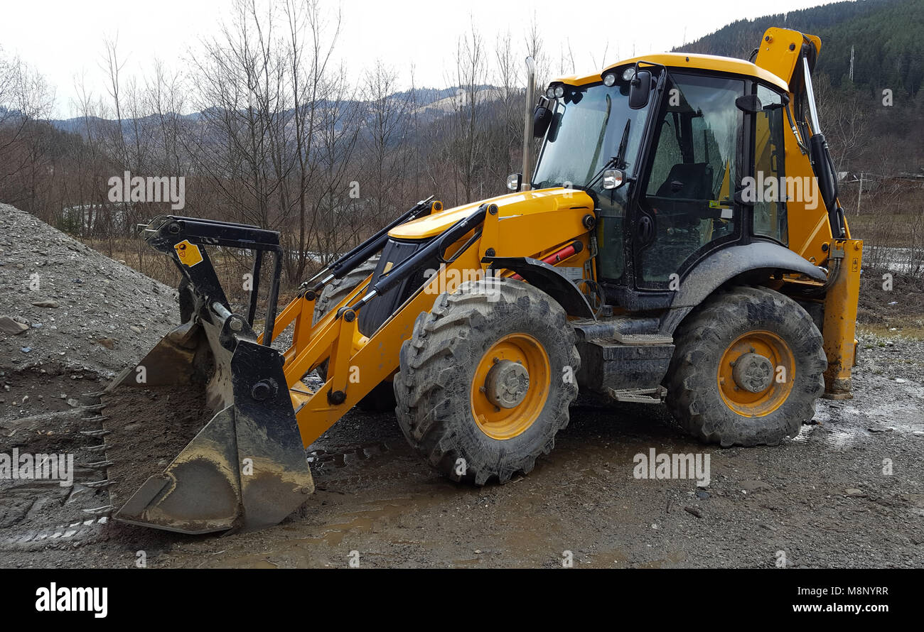 Yellow backhoe hi-res stock photography and images - Alamy