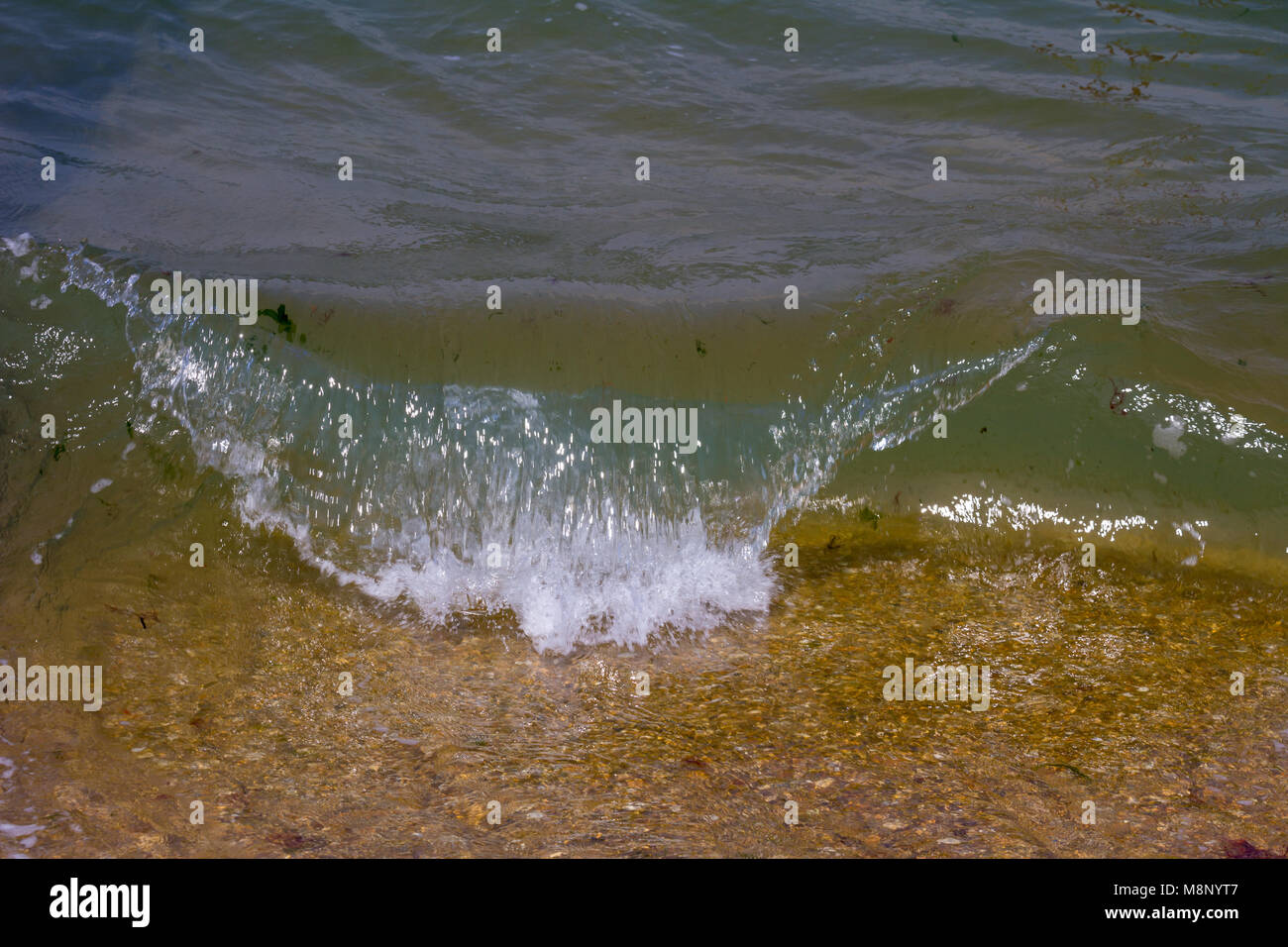 Wave Breaking on Shingle Beach Stock Photo - Alamy